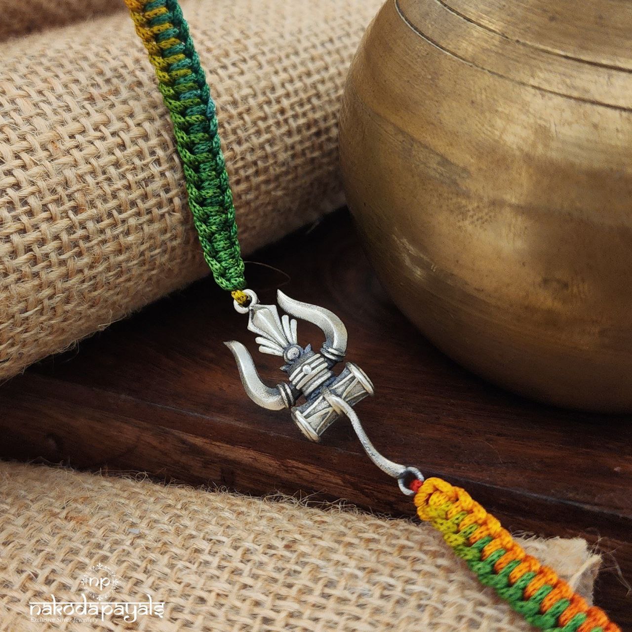 Green Trishul Rakhi (R5676) – Nakoda Payals